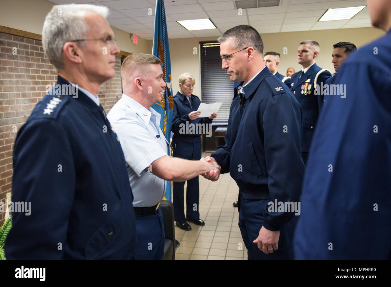 U.S. Coast Guard Capt. Peter Van Ness, center, Telecommunication and ...