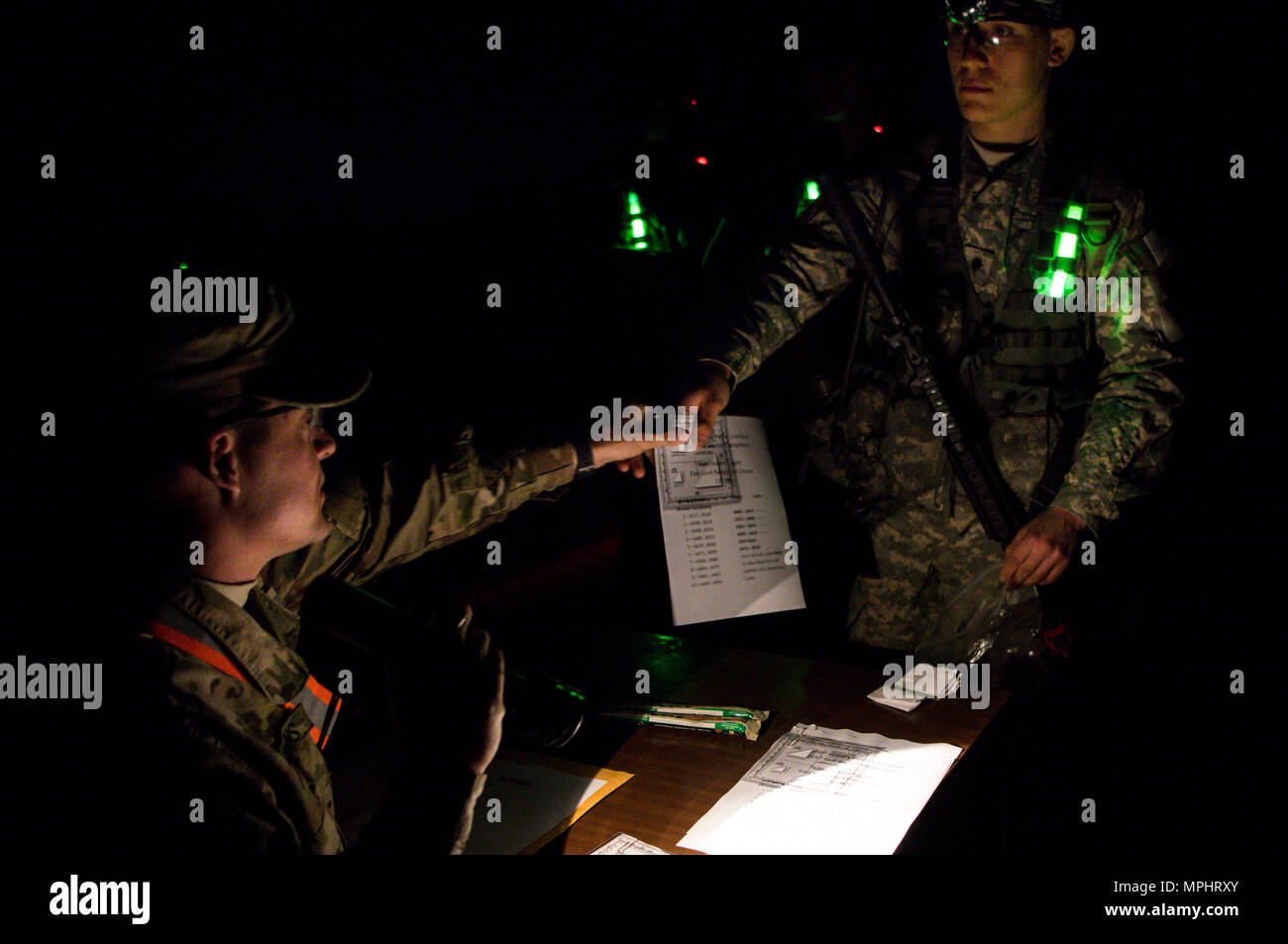 With only the moon light, red flash lights and glow sticks Soldiers ...