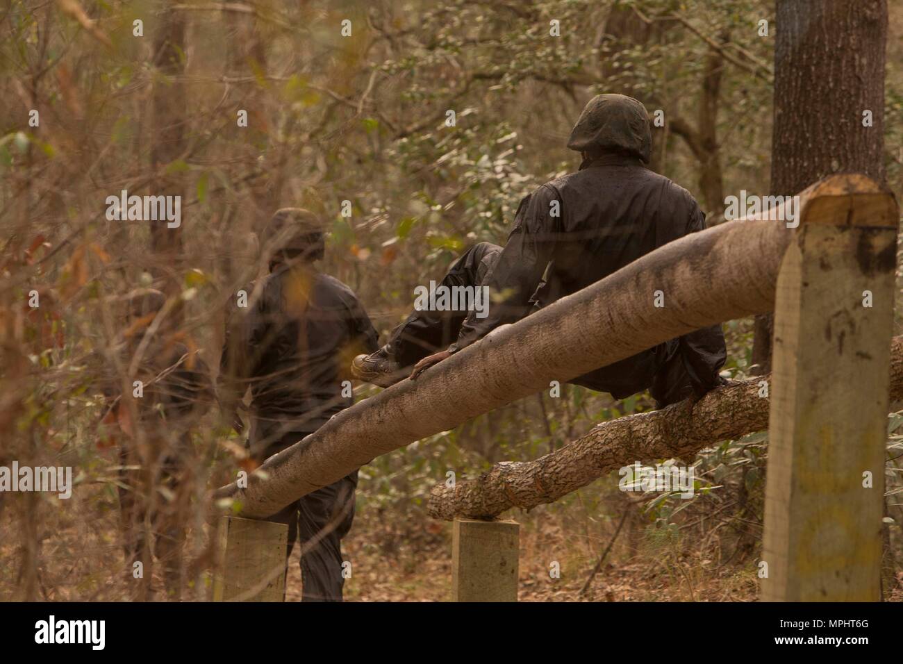 A Marine crosses an obstacle during an endurance course at the Battle ...