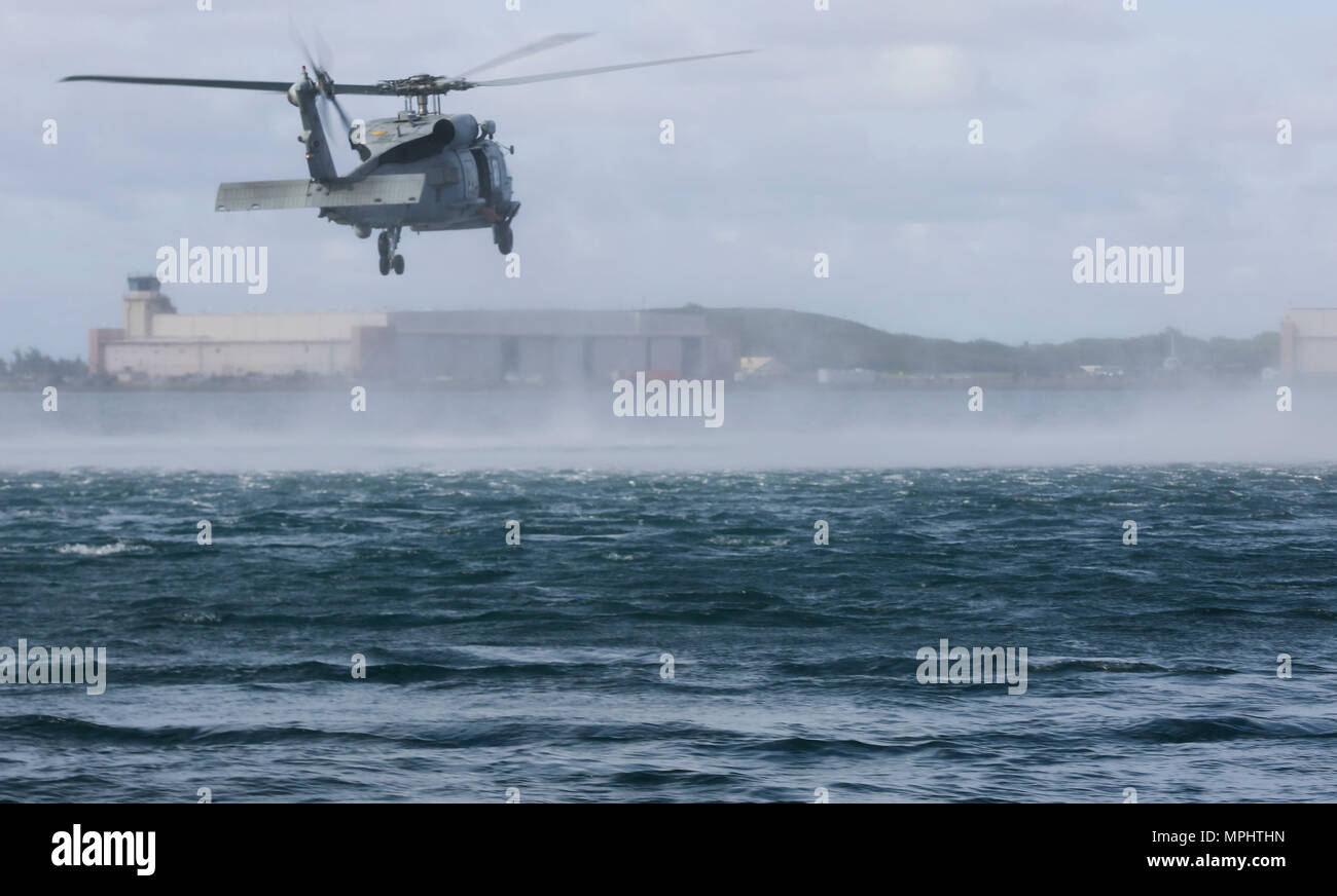 An MH-60R Seahawk helicopter assigned to HSM-37 conducts search and ...