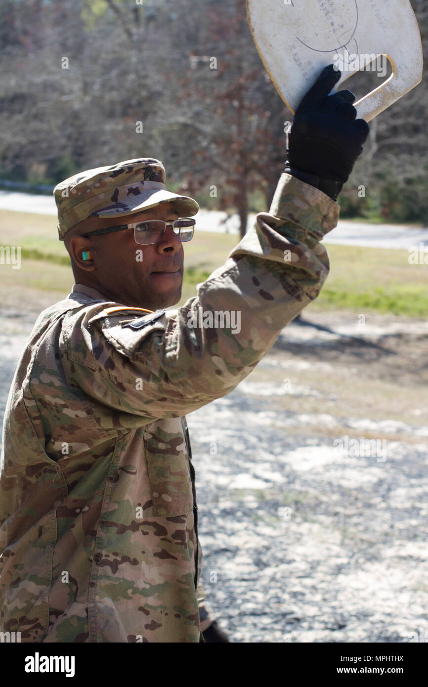 A soldier with the 982nd Combat Camera Company serves as range safety ...