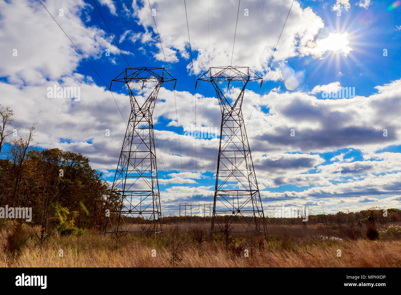 power line against the blue bright sky Stock Photo - Alamy
