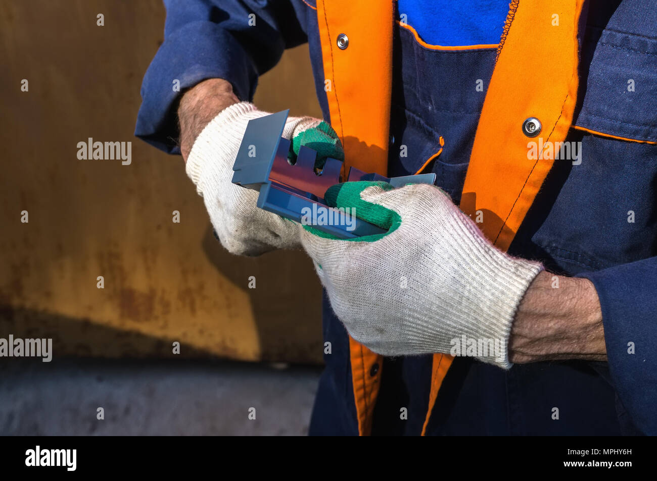 A person working on the installation of electrical meter equipment ...