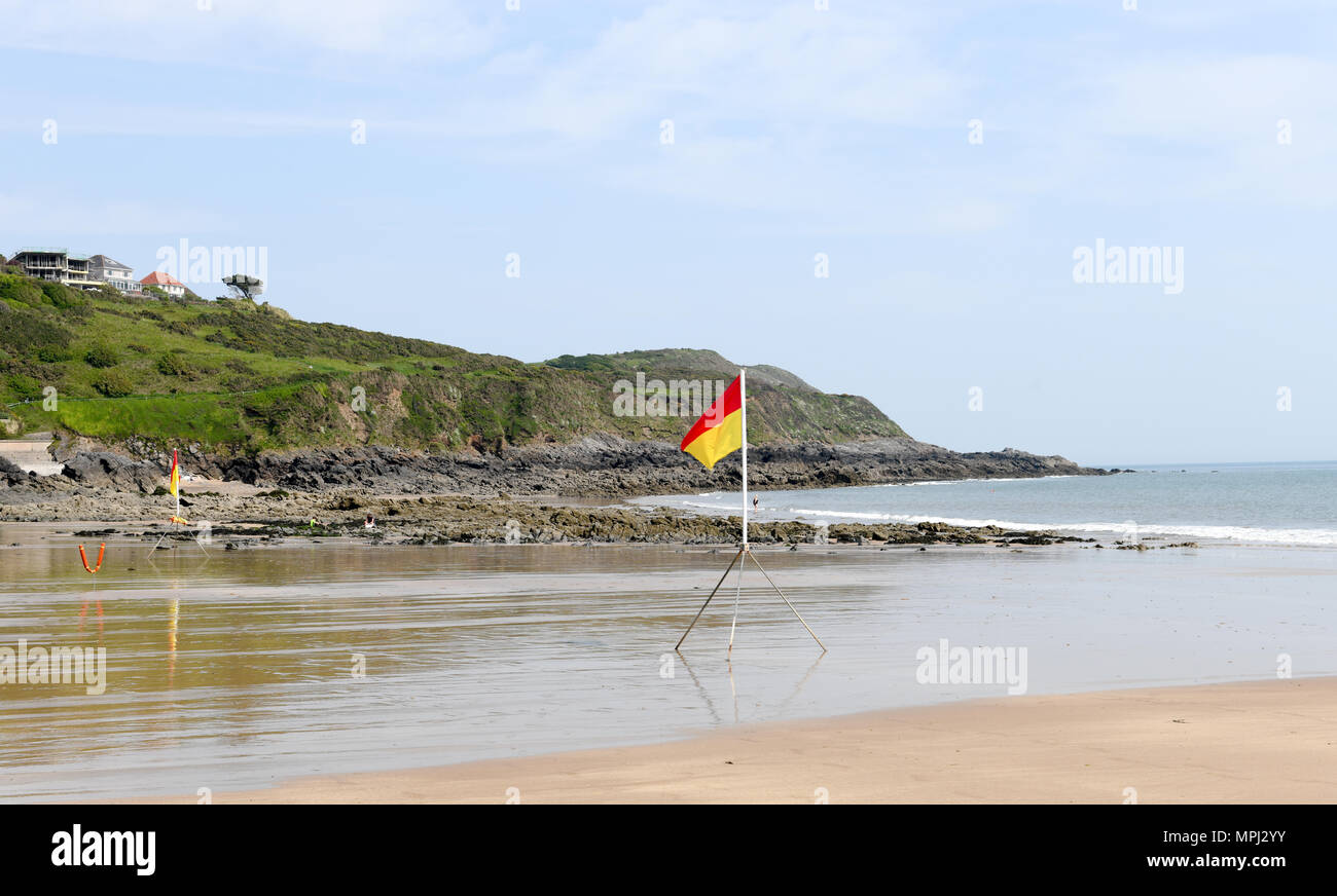 A safety flag flying at Langland Bay, Gower, Swansea, South Wales. This ...