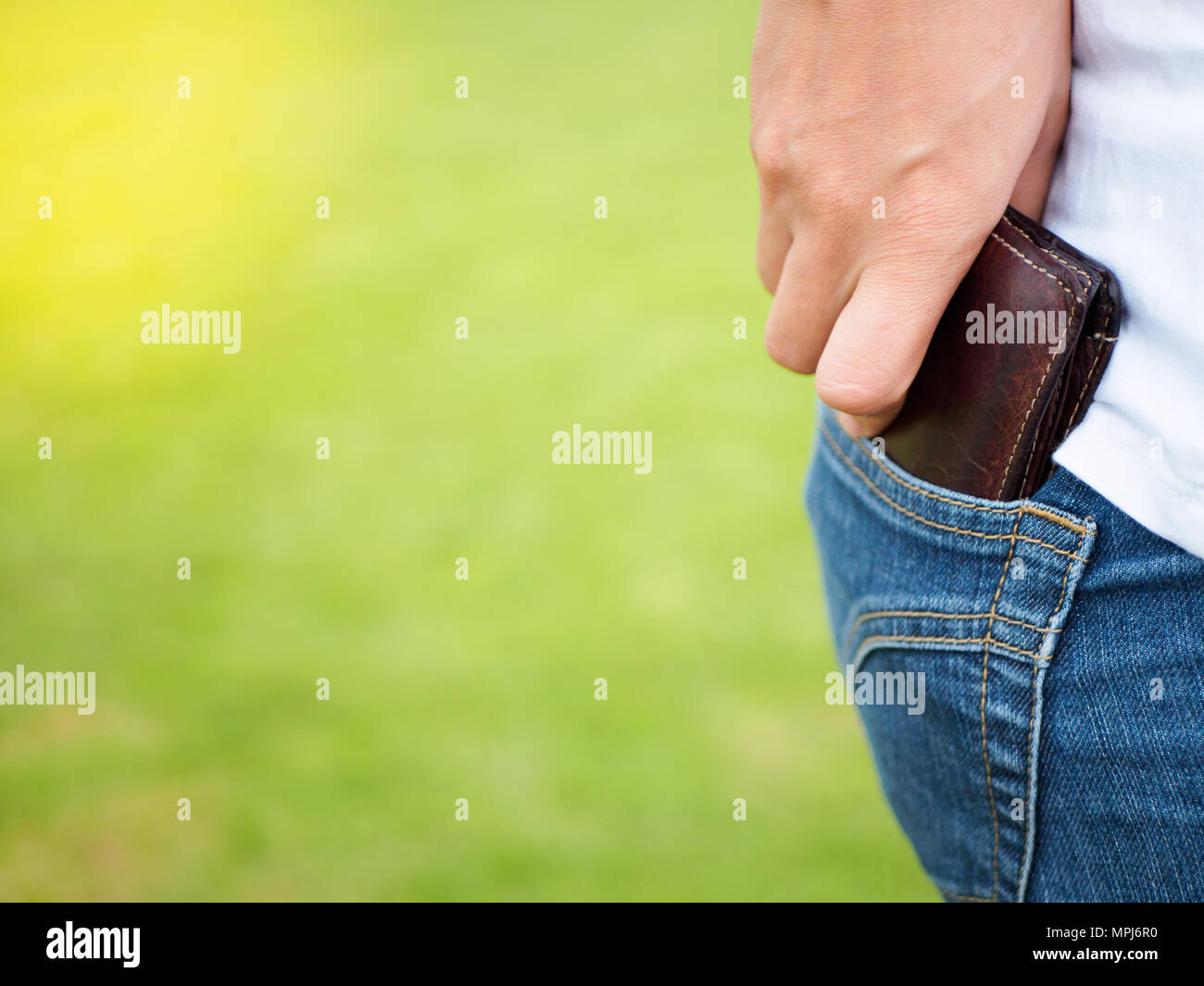 Women's hand taking wallet from his own pocket Stock Photo - Alamy