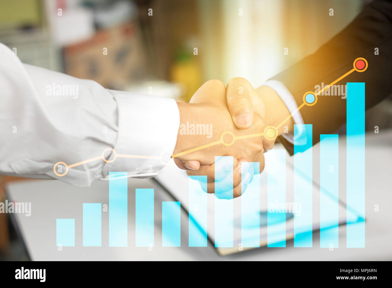 businessman shaking hands and finance graph, succes s concept Stock ...