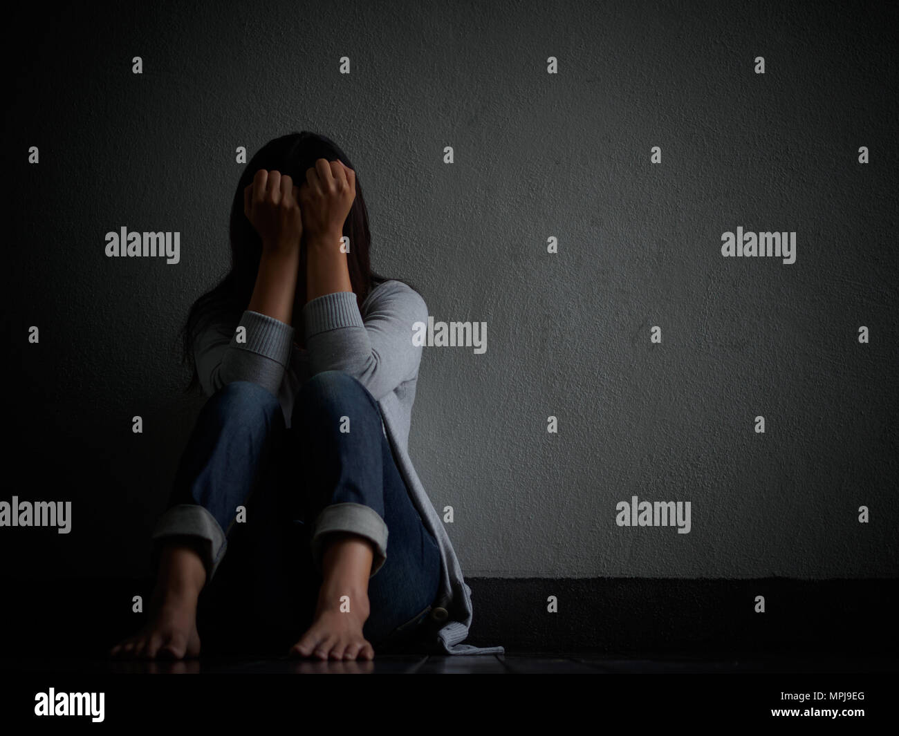 Sad Woman Hug Her Knee And Cry Sad Woman Sitting Alone In A Empty Room