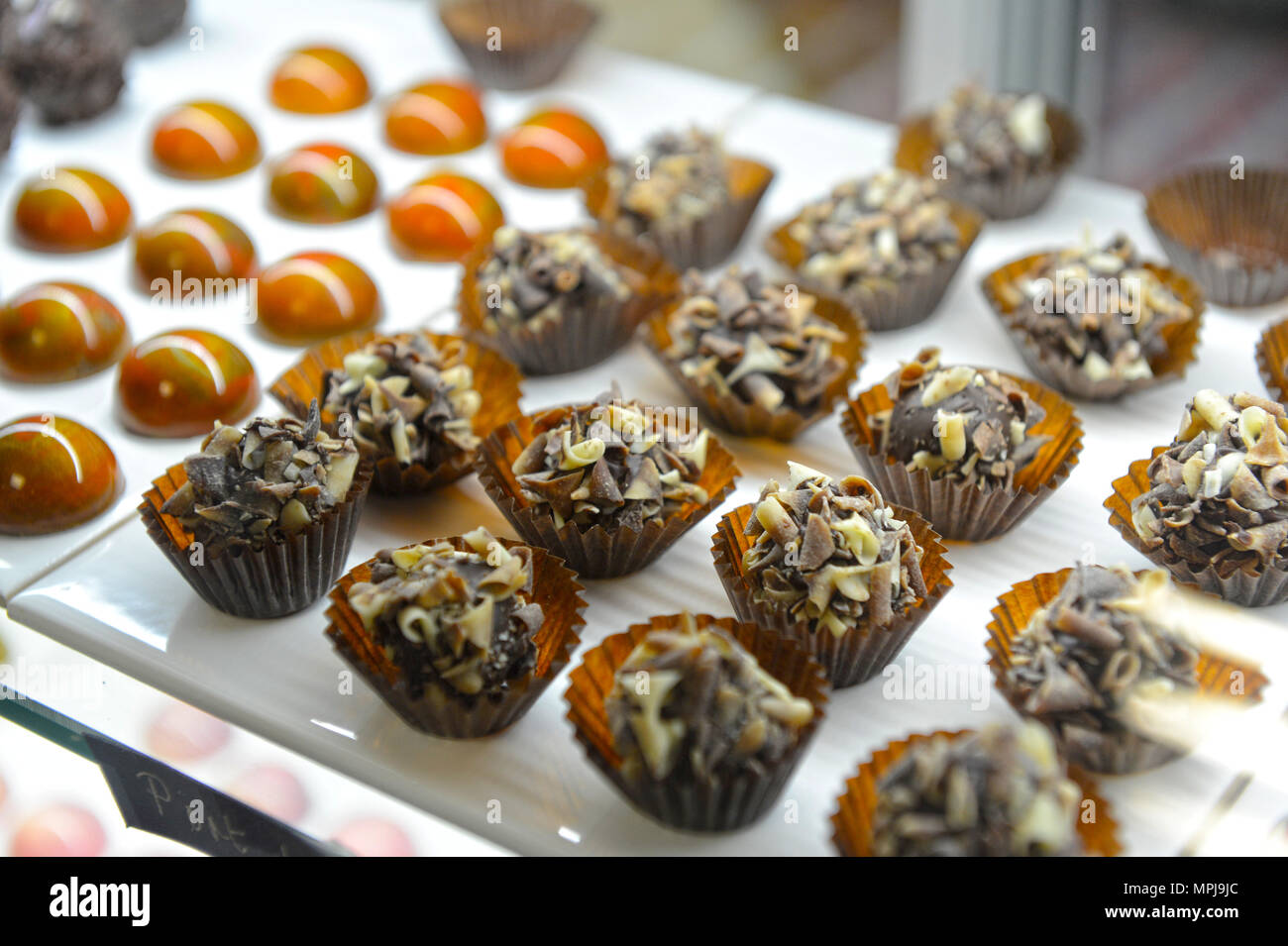 Shop counter with luxurious hand made chocolates in a variety of ...