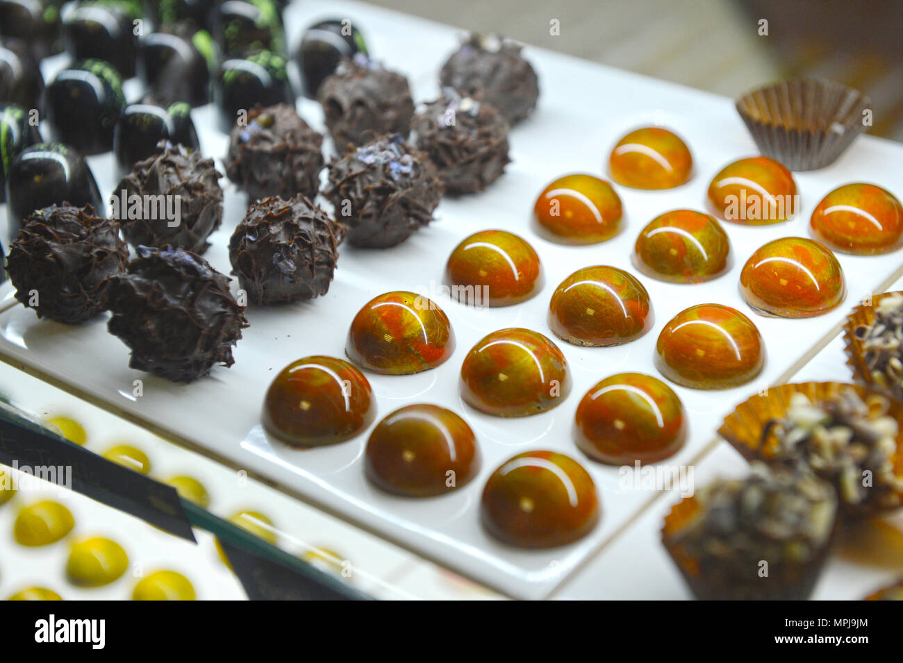Shop counter with luxurious hand made chocolates in a variety of ...