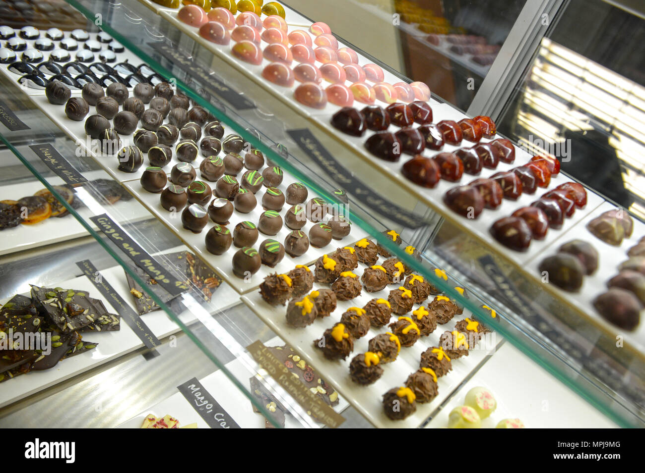 Shop counter with luxurious hand made chocolates in a variety of ...
