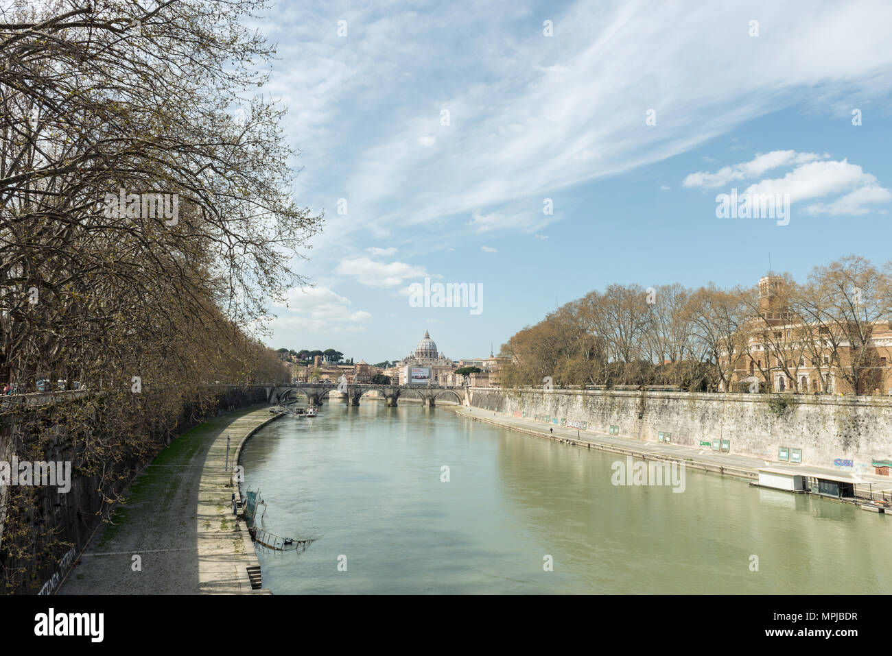 Wide angle picture of Tiber River, local trees and old buildings in ...
