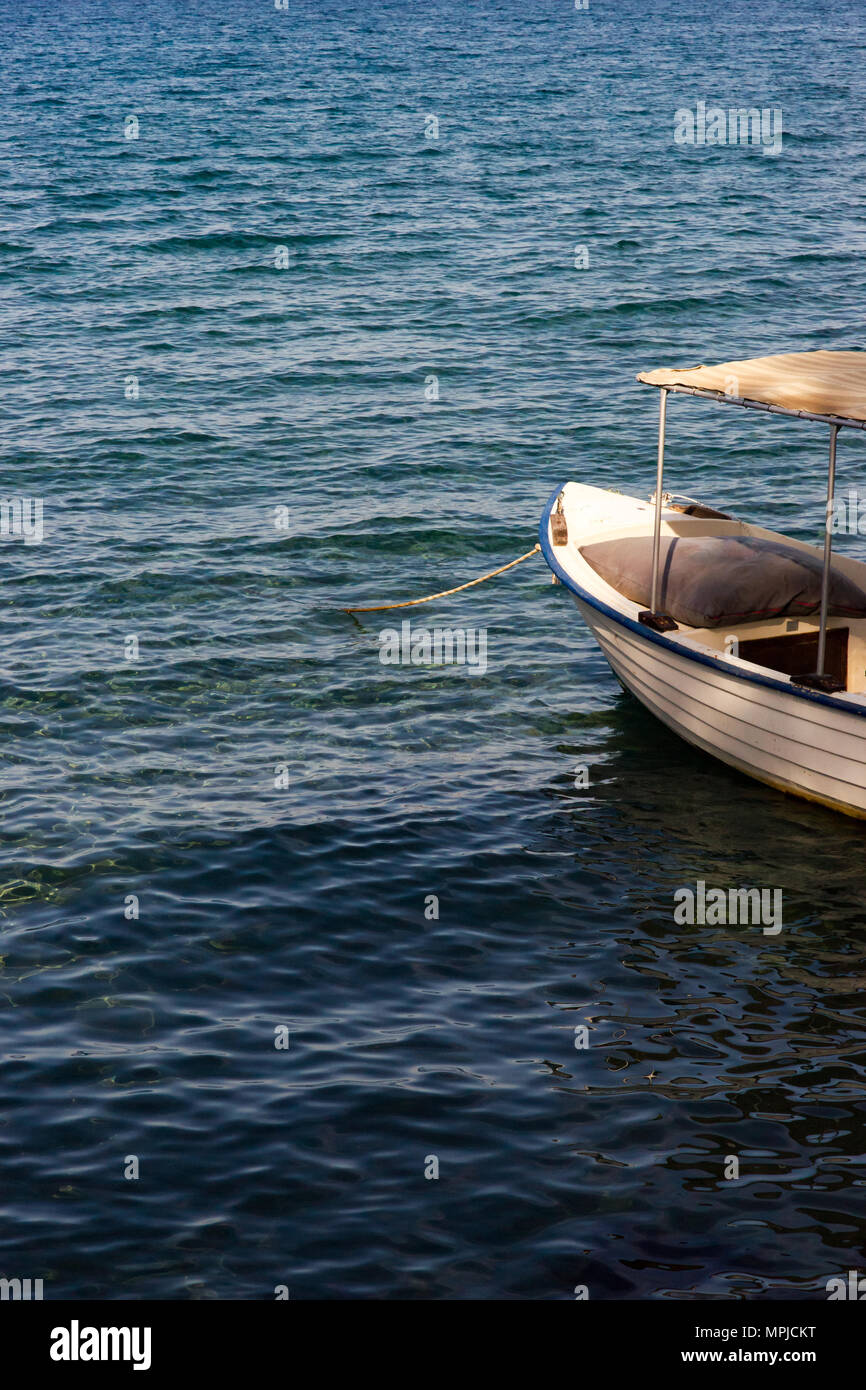 boat on blue water Stock Photo - Alamy