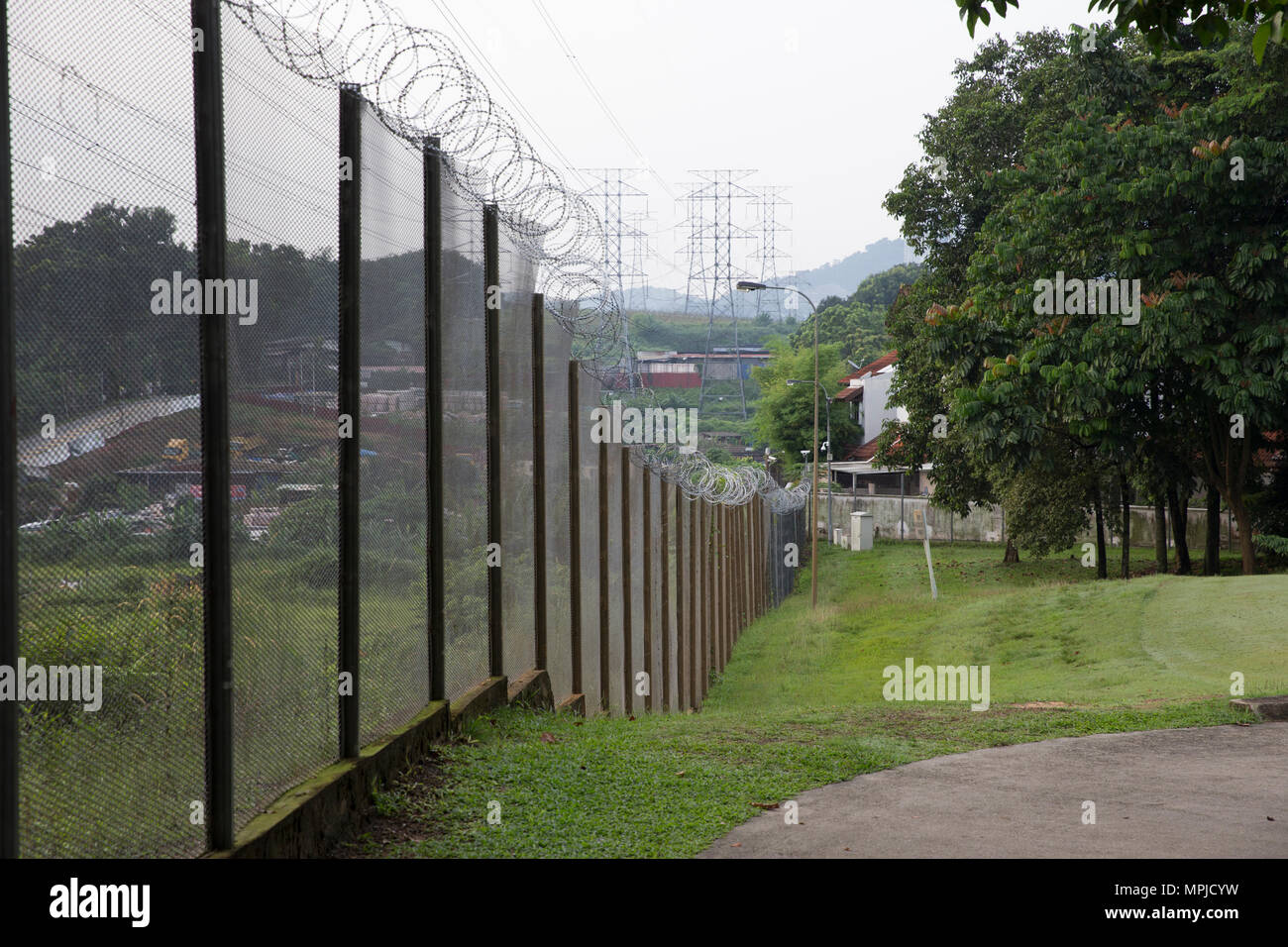 Security post and fencing on the golf course in an exclusive gated ...
