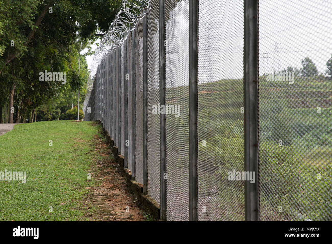 Security post and fencing on the golf course in an exclusive gated ...