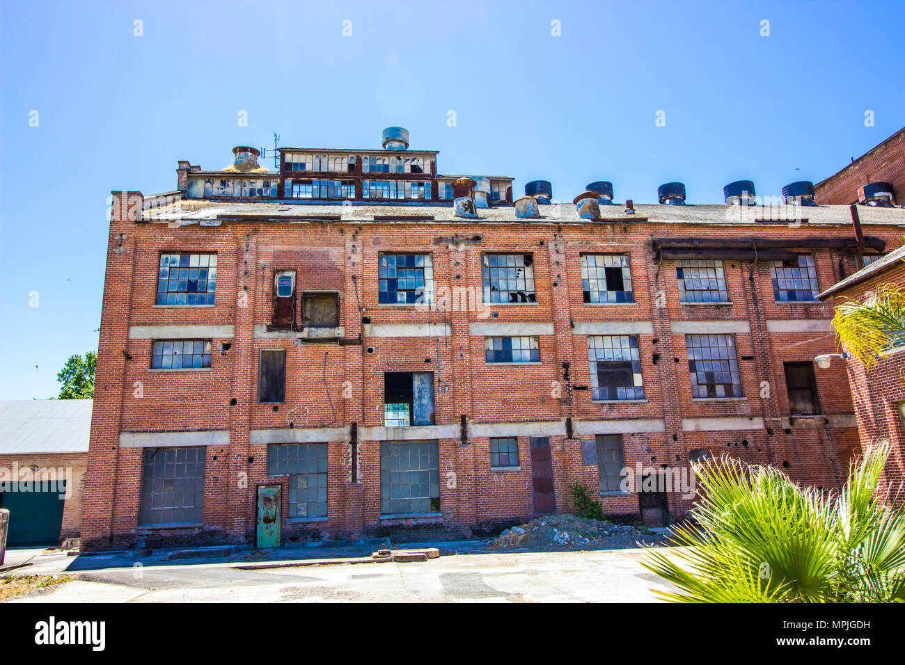 Vintage Multi Story Building Once Used As A Mill Stock Photo - Alamy