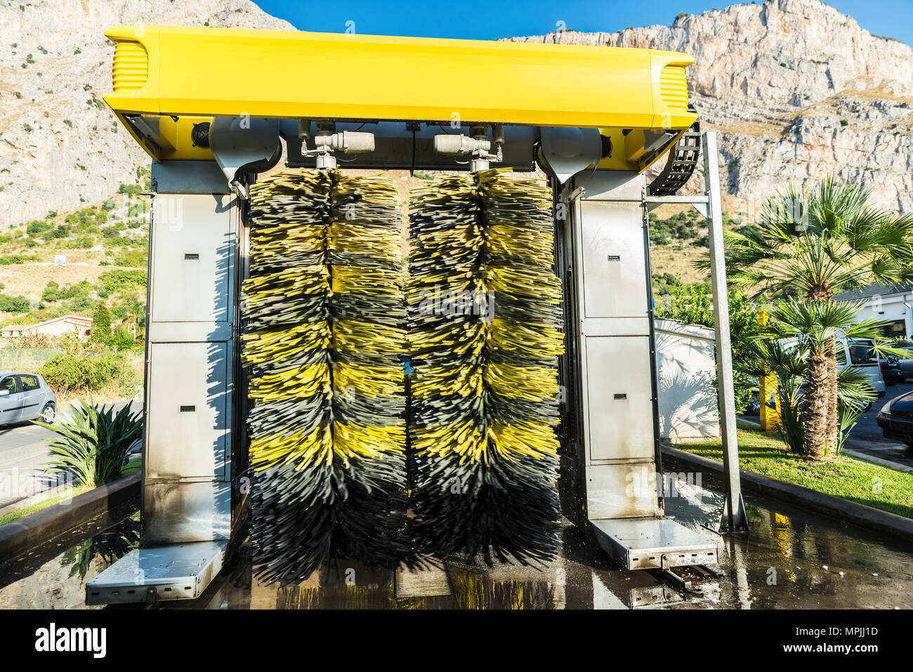 Rotating roller dusters in an automatic washing car at a gas station in ...