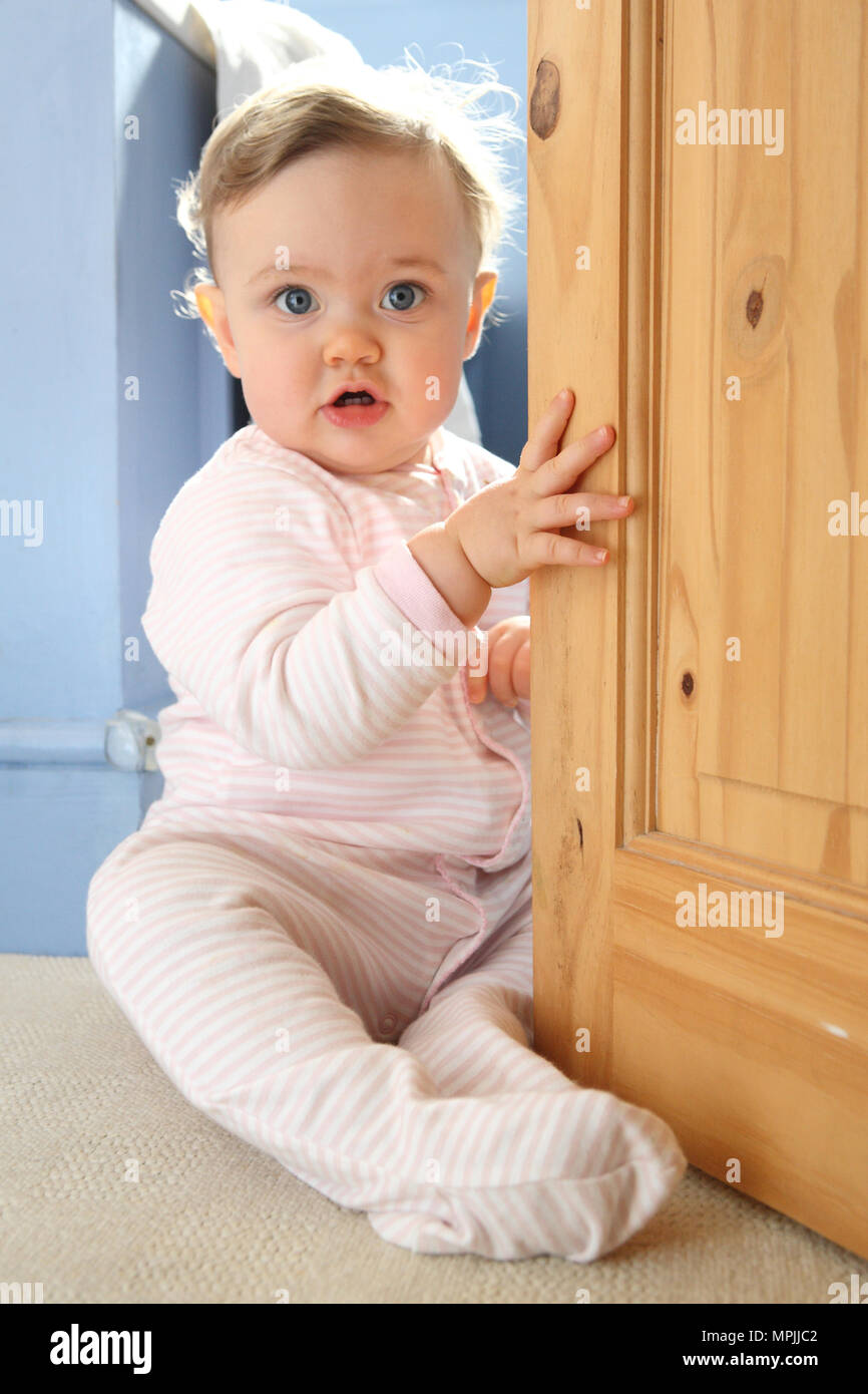 Curious baby girl opens the bathroom door to say hello, age 9 to 15 ...