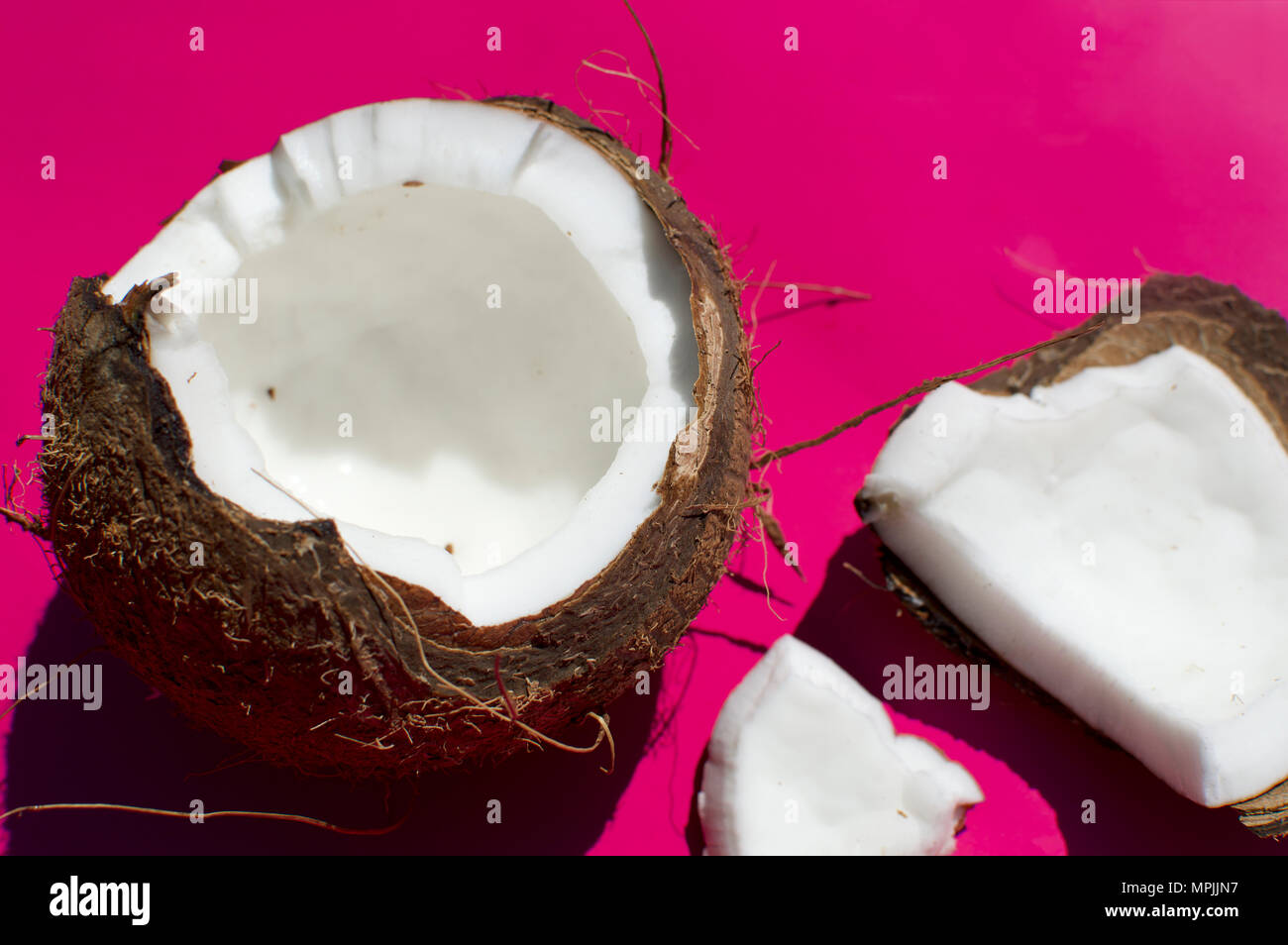coconut on pink background Stock Photo - Alamy