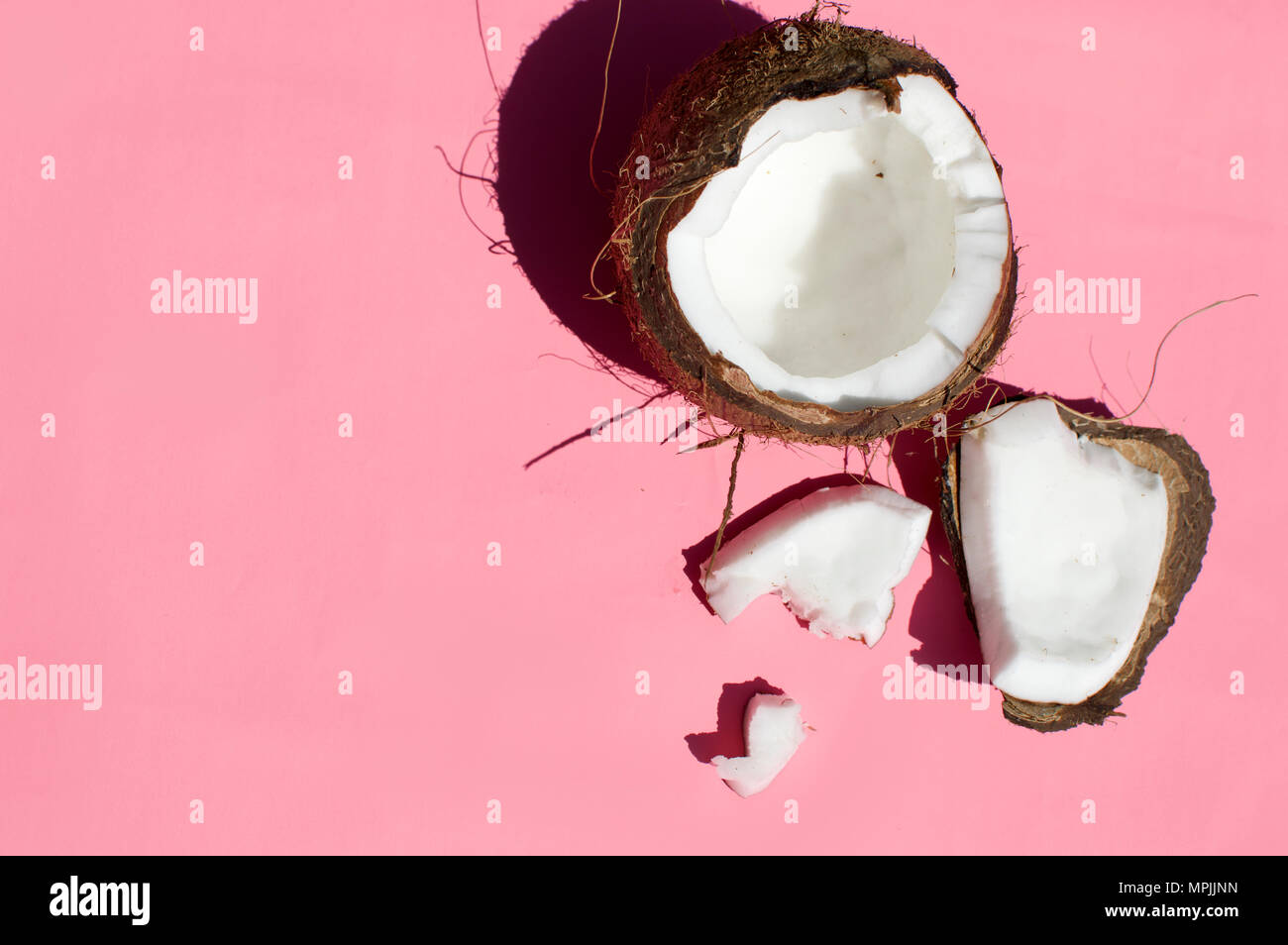 coconut on pink background Stock Photo - Alamy