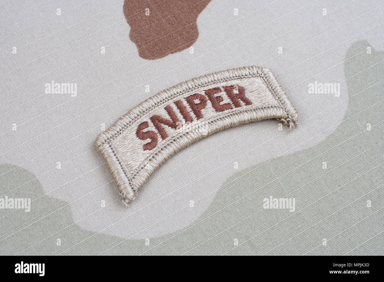 KIEV, UKRAINE - May 18, 2015. US ARMY sniper tab on camouflage uniform ...