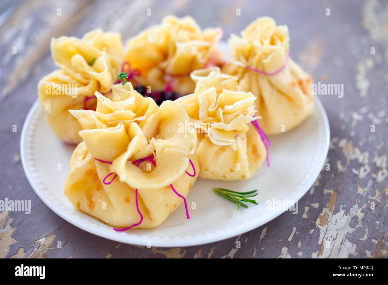 Crepe purse filled with cream cheese Stock Photo - Alamy