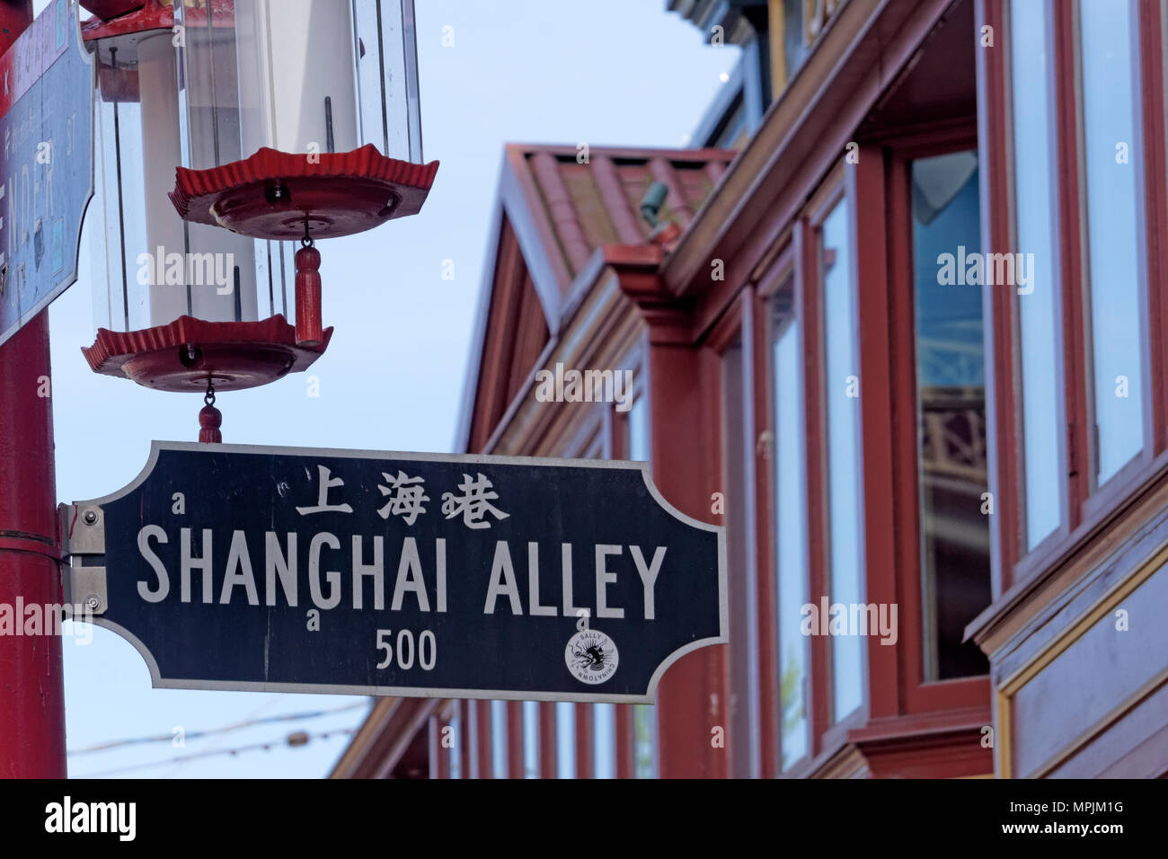 Shanghai Alley street sign with historic Sam Kee Building in background ...