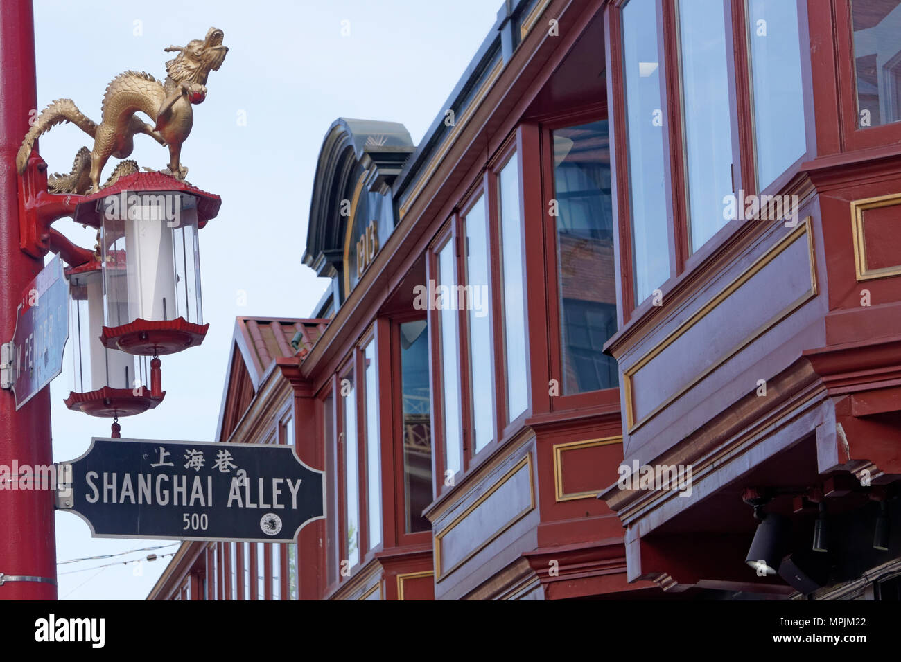 Shanghai Alley street sign with historic Sam Kee Building in background ...