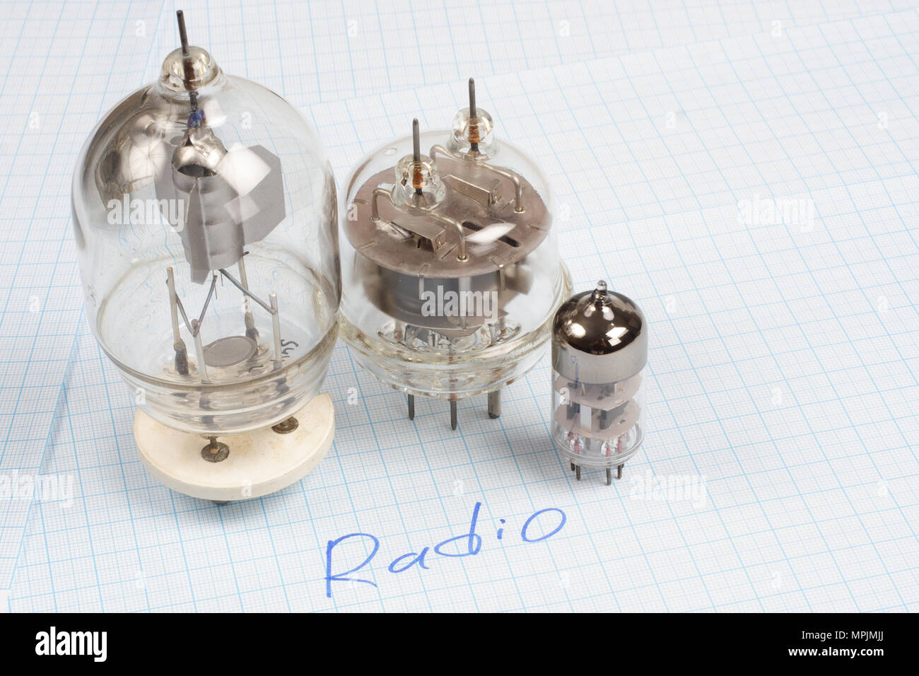 old vacuum tube (electron tube) on graph paper background Stock Photo ...