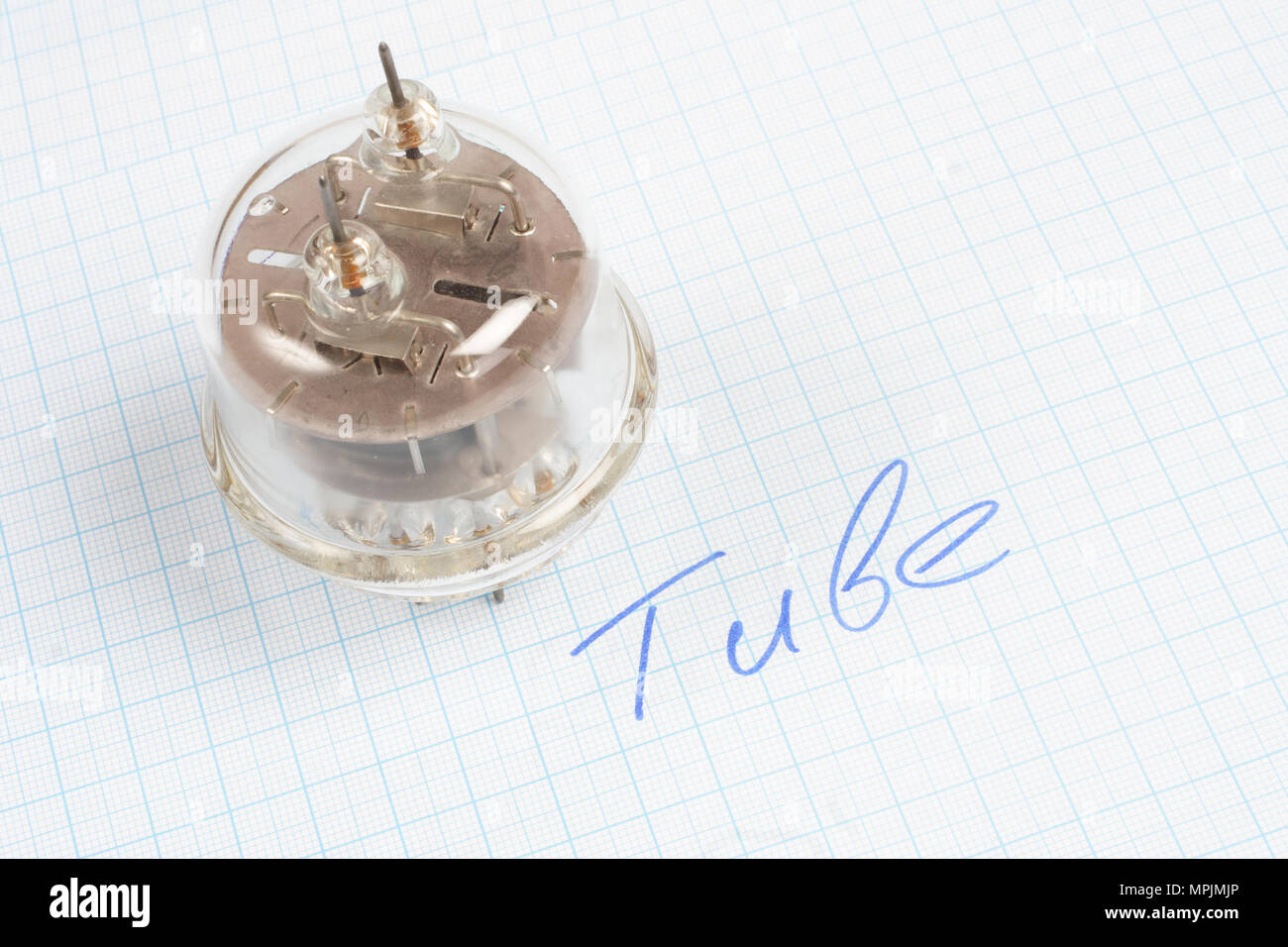 old vacuum tube (electron tube) on graph paper background Stock Photo ...