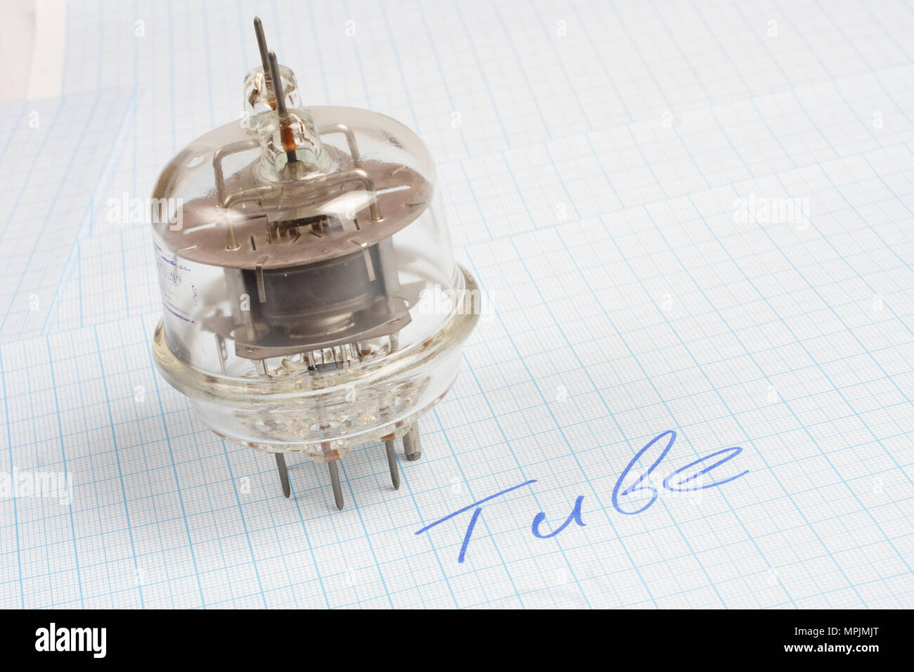 old vacuum tube (electron tube) on graph paper background Stock Photo ...