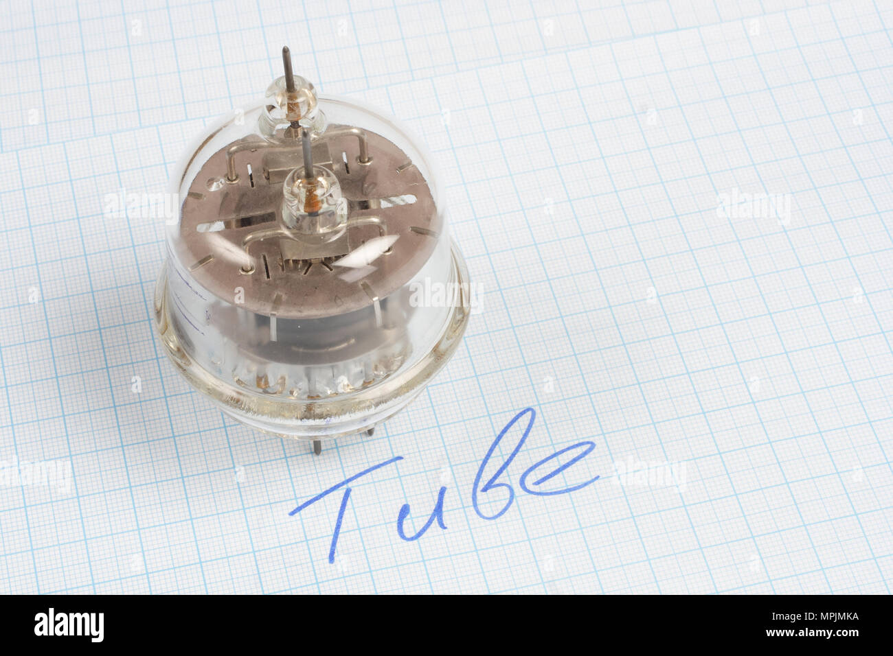 old vacuum tube (electron tube) on graph paper background Stock Photo ...