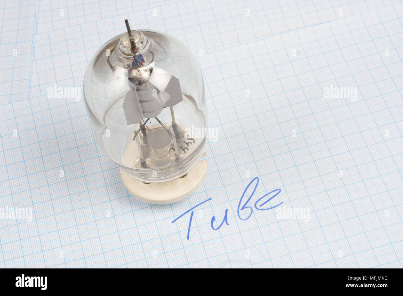 old vacuum tube (electron tube) on graph paper background Stock Photo ...