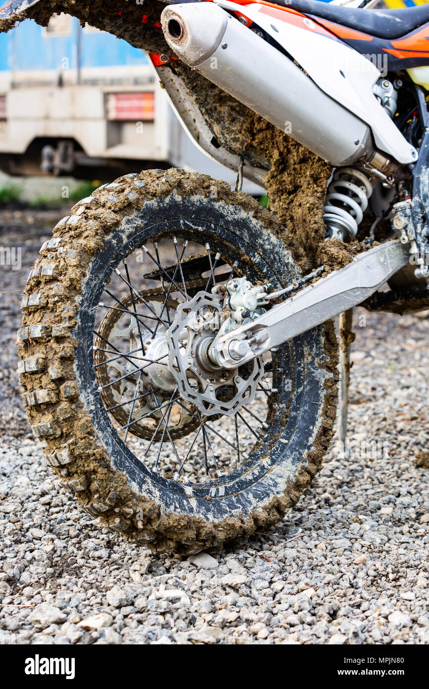 Close-up of mountain off-road motorcycle wheel in the mud Stock Photo ...