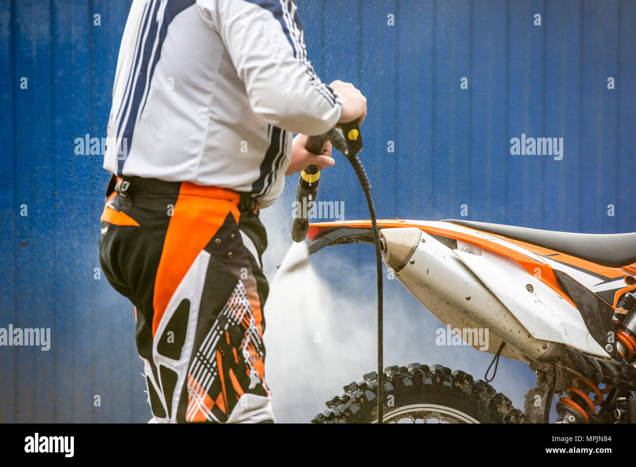 biker washes a motorcycle Stock Photo - Alamy