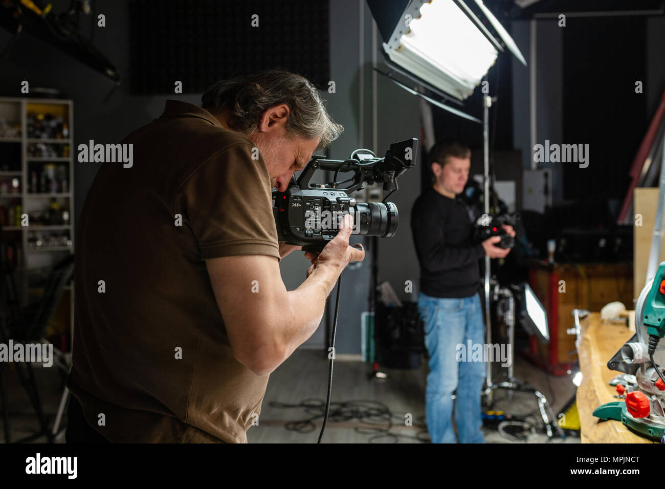 camera operator working with a cinema camera Stock Photo - Alamy