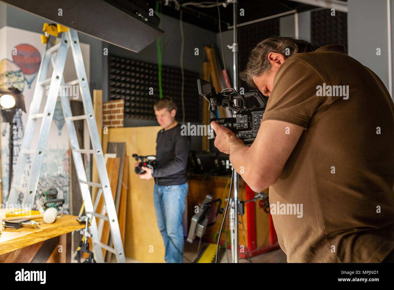 camera operator working with a cinema camera Stock Photo - Alamy