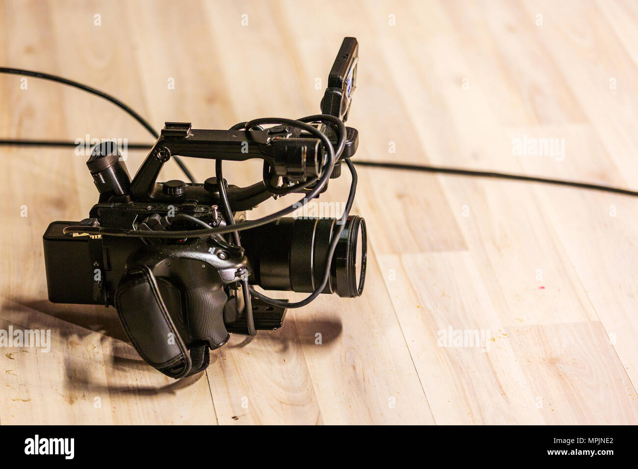 Professional video camera on the floor Stock Photo - Alamy