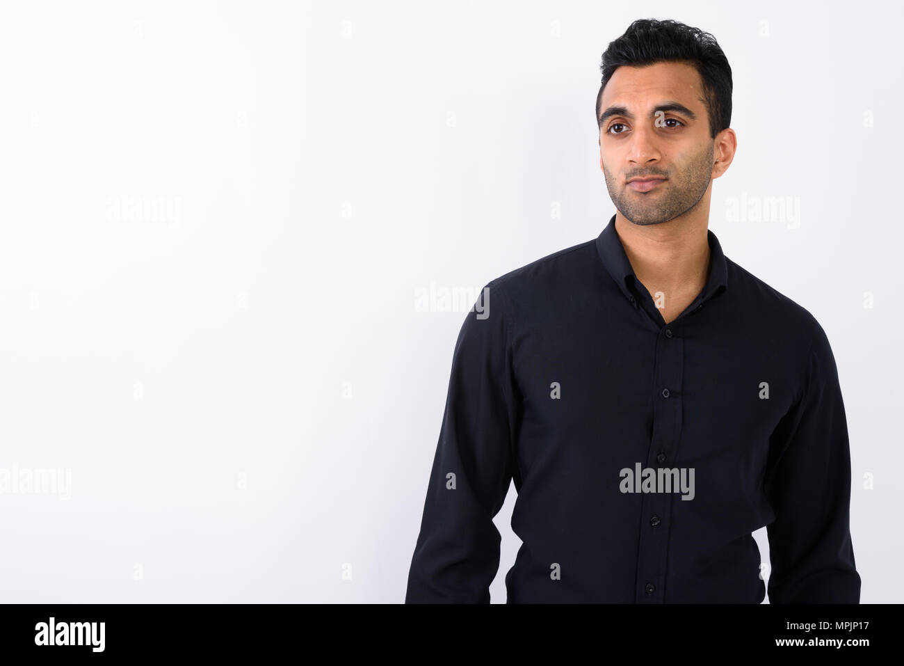 Young handsome Indian businessman against white background Stock Photo ...