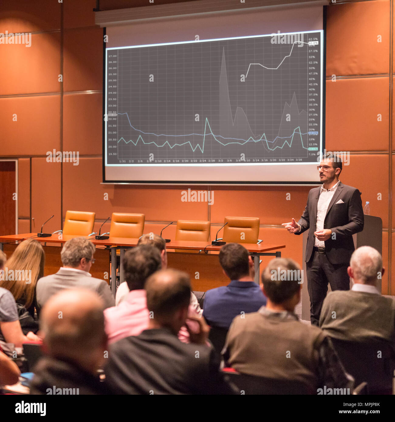 Business speaker giving a talk at business conference event Stock Photo ...