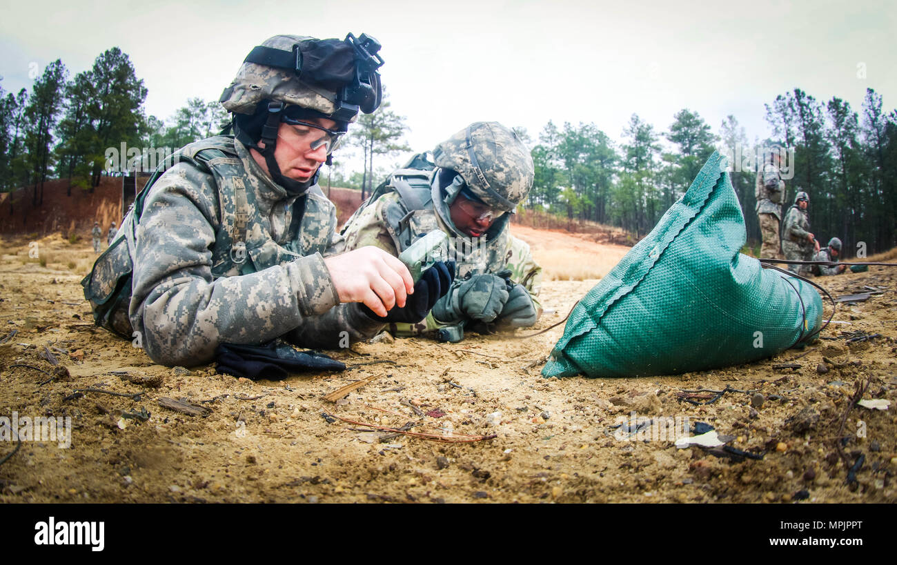 Staff Sgt. Layne (right) observes as a Soldier with 122nd Aviation ...