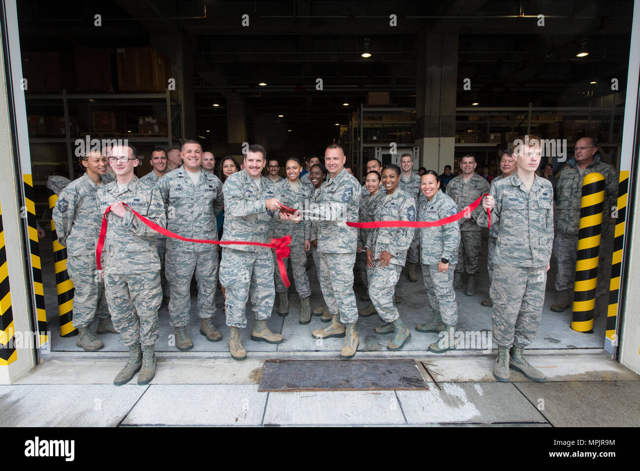 U.S. Air Force Col. Christopher Amhrein, 18th Wing vice commander, cuts ...