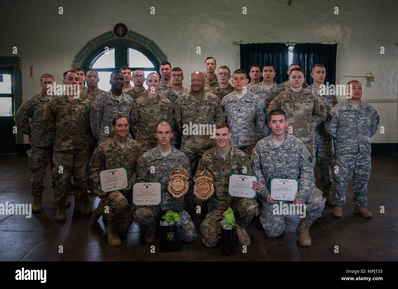 Command Sgt. Maj. Craig Owens takes a photo with the remaining 23 ...