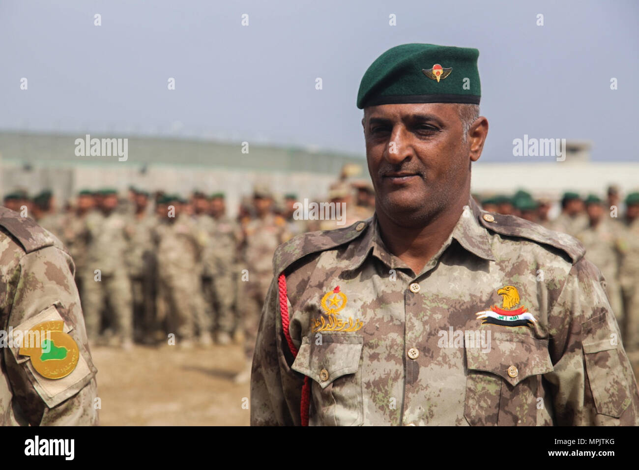 An Iraqi securtiy forces soldier waits to recieve an award during a ...