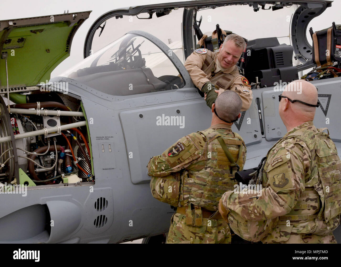 Train, Advise, Assist Command-Air (TAAC-Air) advisors welcome a U.S. pilot after transporting an ...
