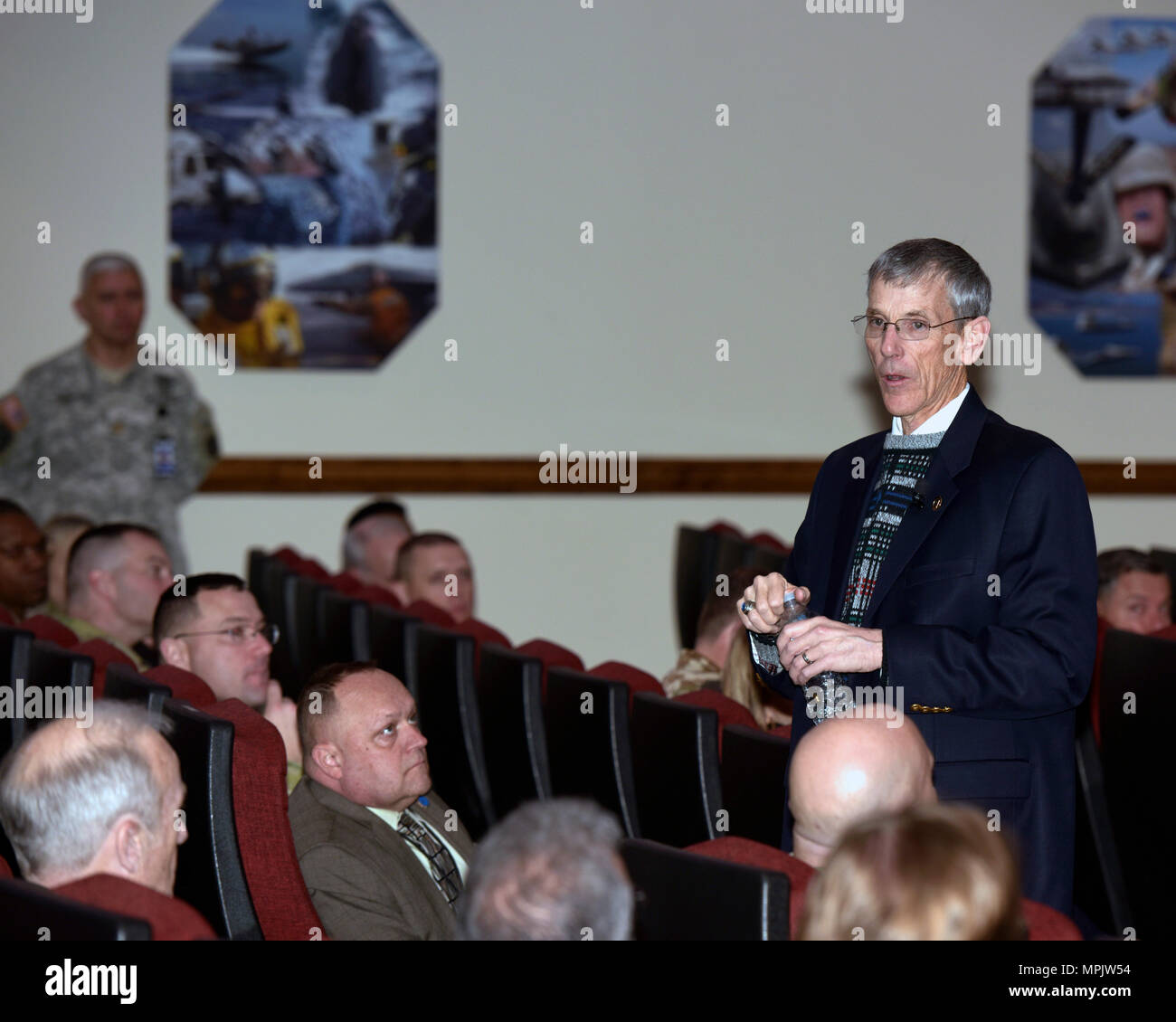 The Hon. Robert M. Speer, the Acting Secretary of the Army, speaks with ...
