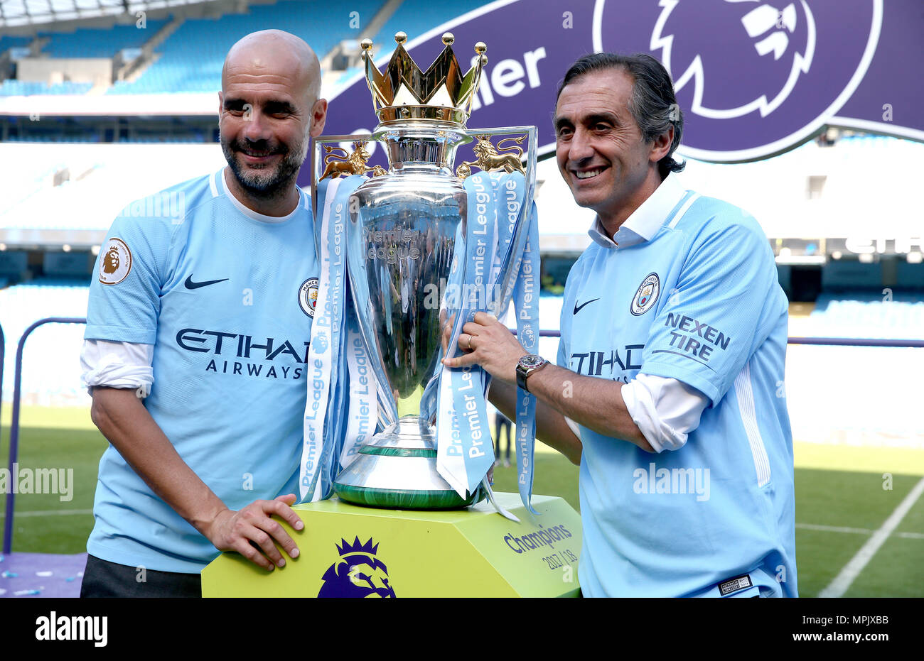 Pep Guardiola (left) celebrates with the trophy and Manuel Estiarte ...