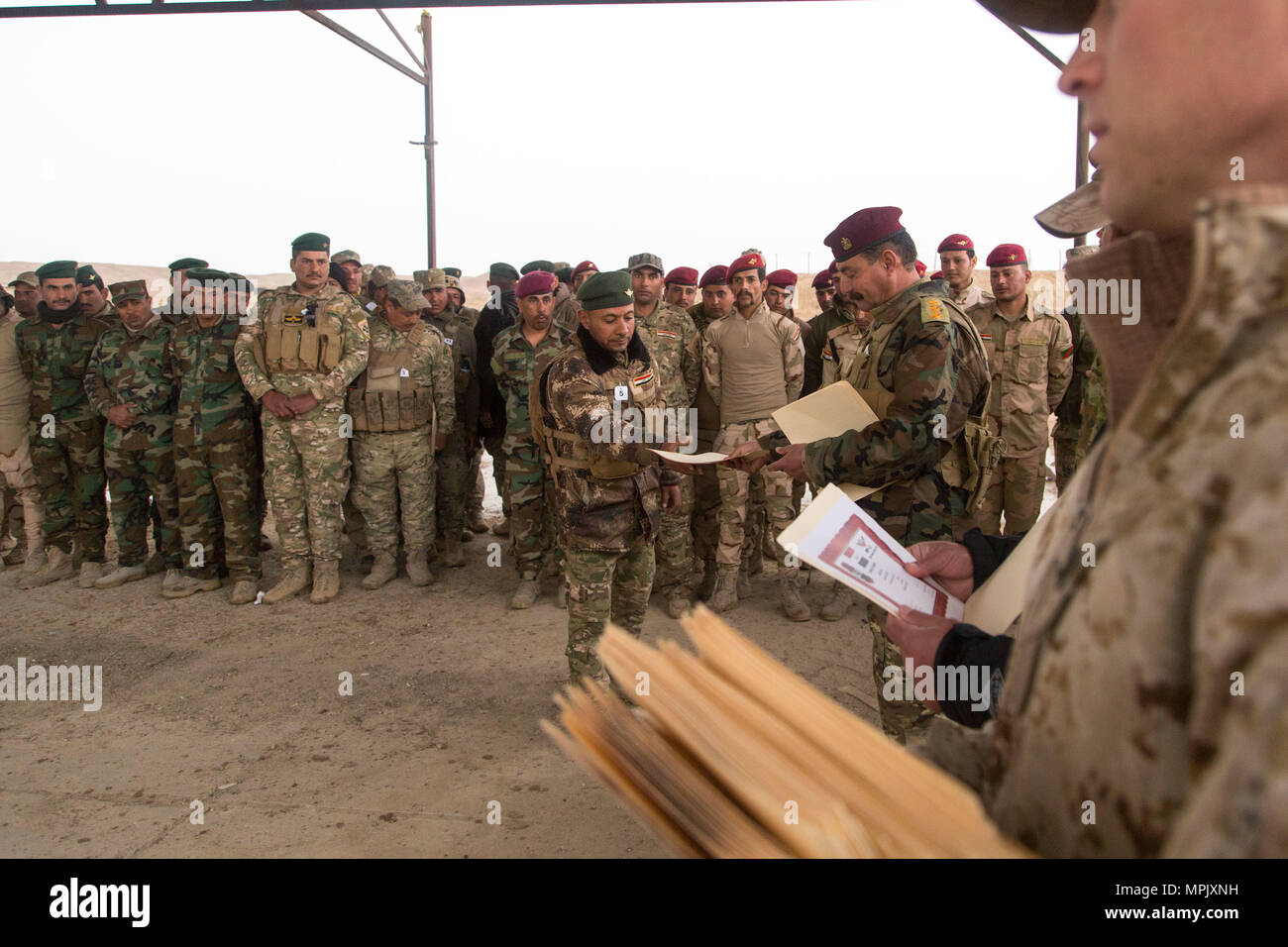 Iraqi security forces soldiers receive certificates of completion ...