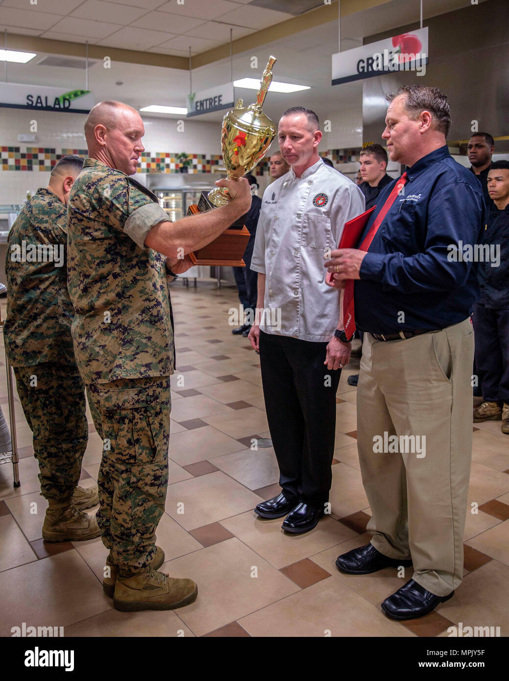 U.S. Marine Corps Col. Scott A. Baldwin, left, assistant chief of staff ...