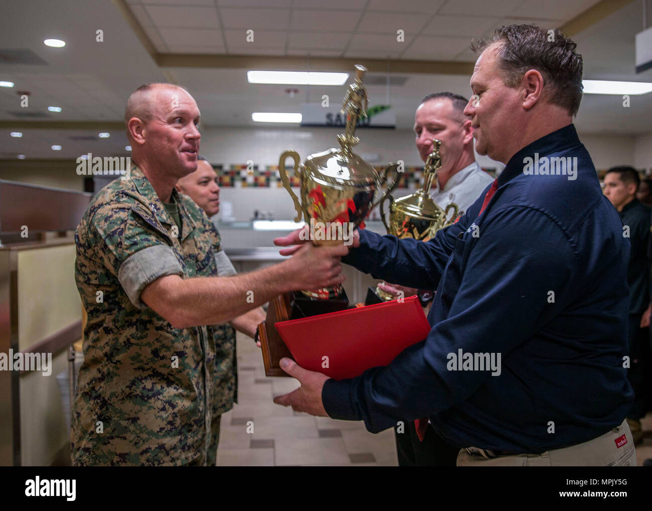 U.S. Marine Corps Col. Scott A. Baldwin, left, assistant chief of staff ...
