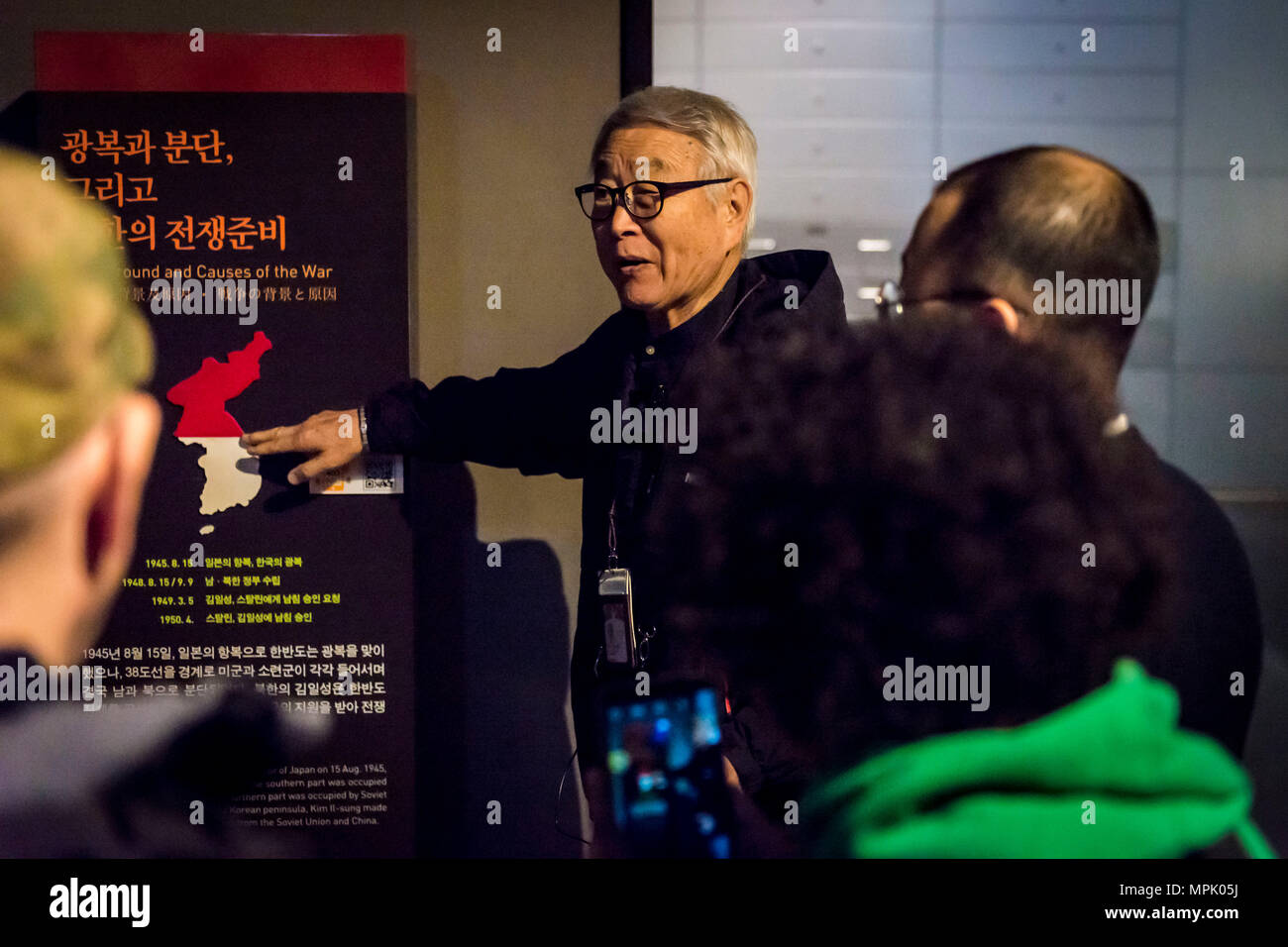 Lee Song Ha, a War Memorial of Korea tour guide, explains the dividing ...